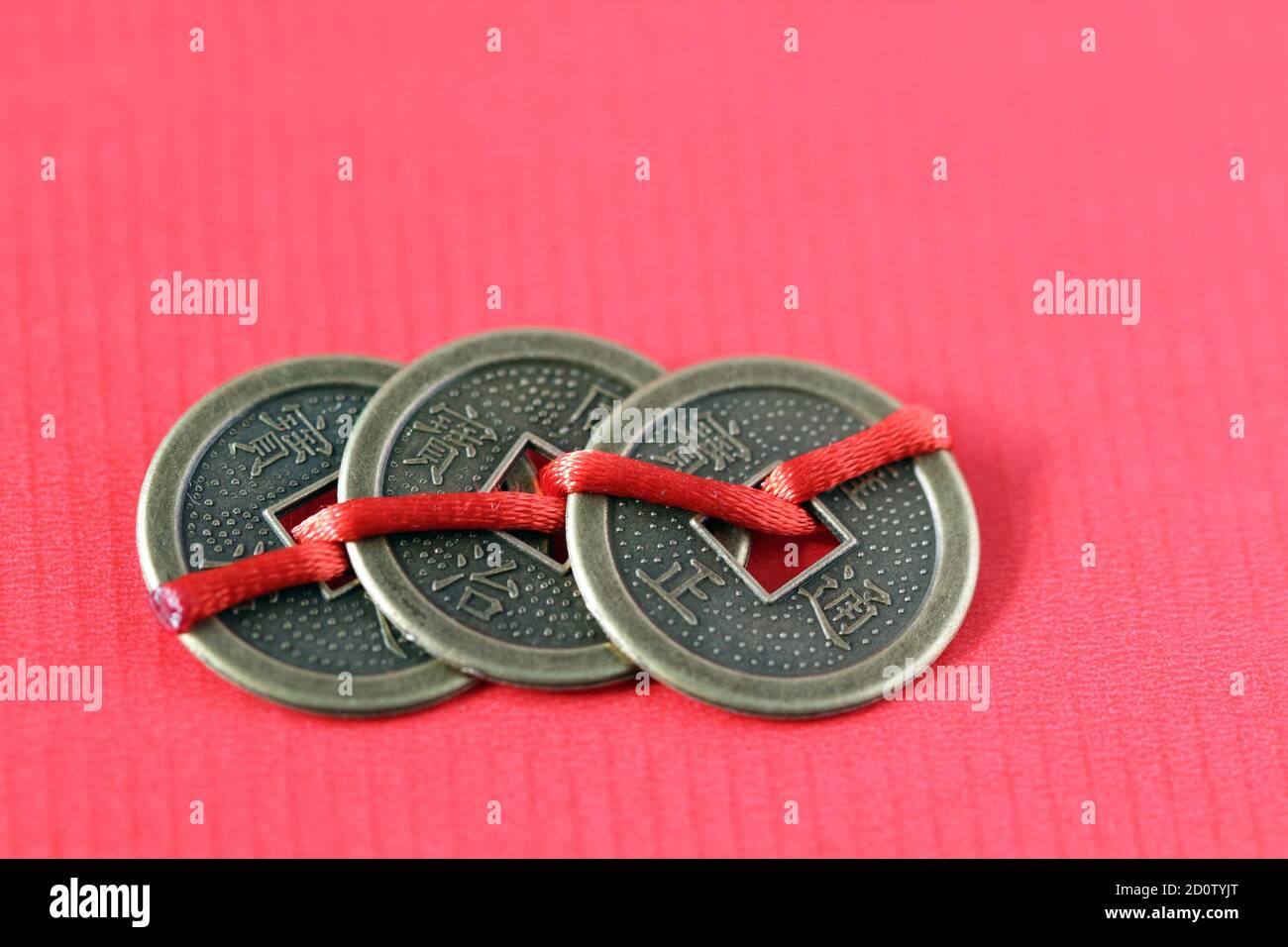 Chinese coins red ribbon hi-res stock photography and images - Alamy