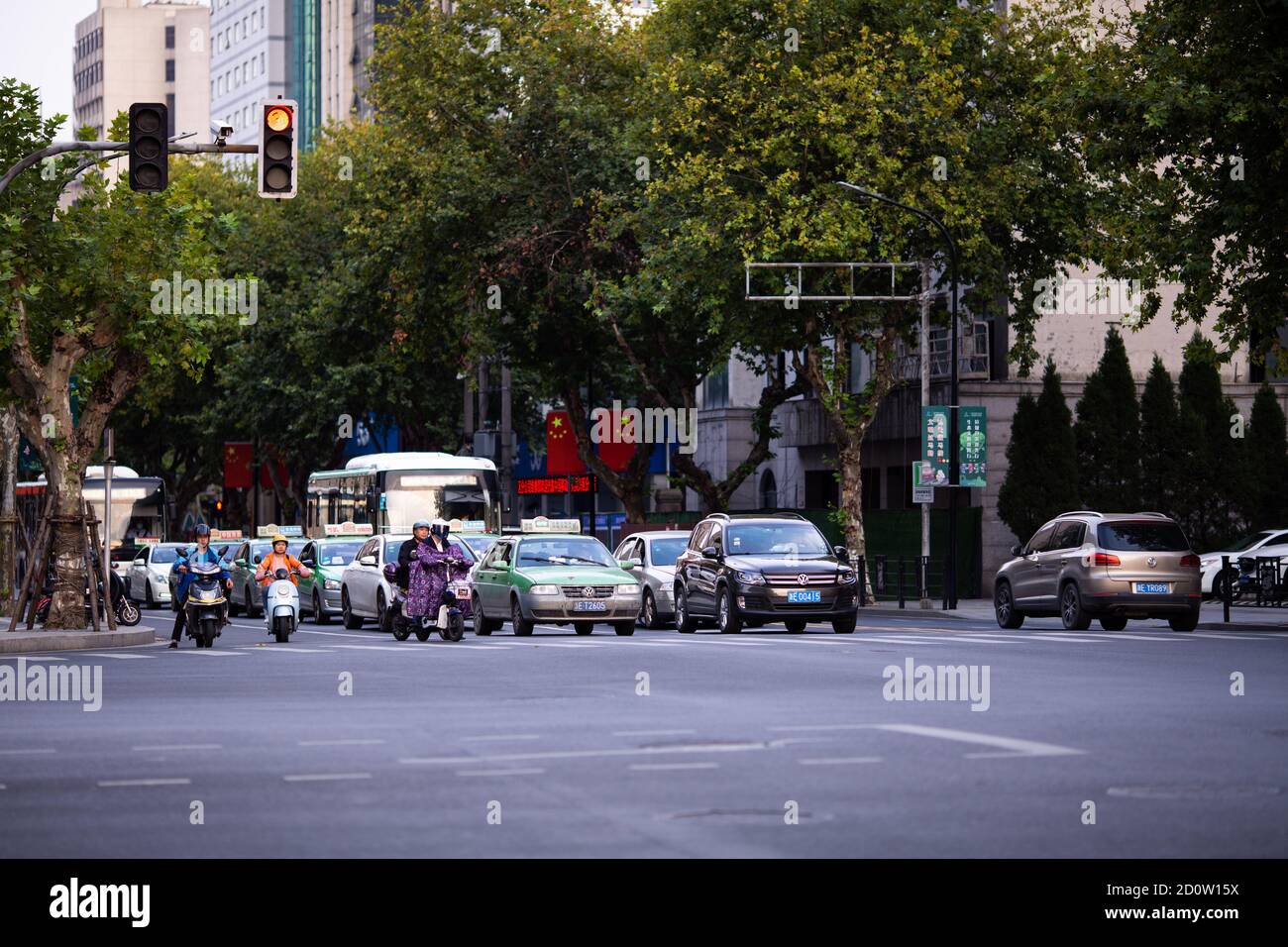 Huzhou, China 2020 September 28: Electric scooters and Car rush hours ...