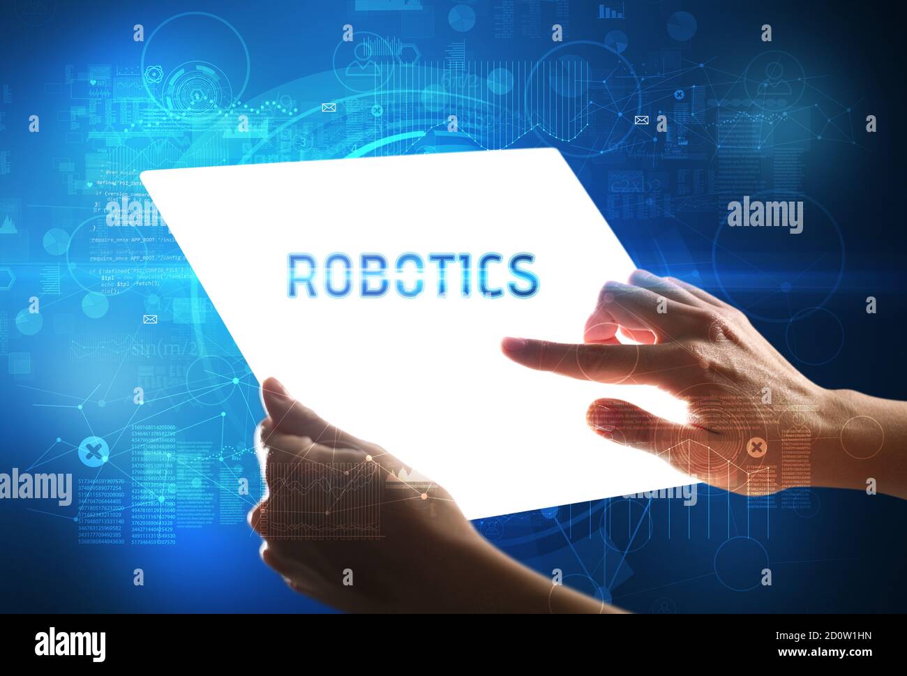 Hand holdig futuristic tablet with ROBOTICS inscription, new technology ...