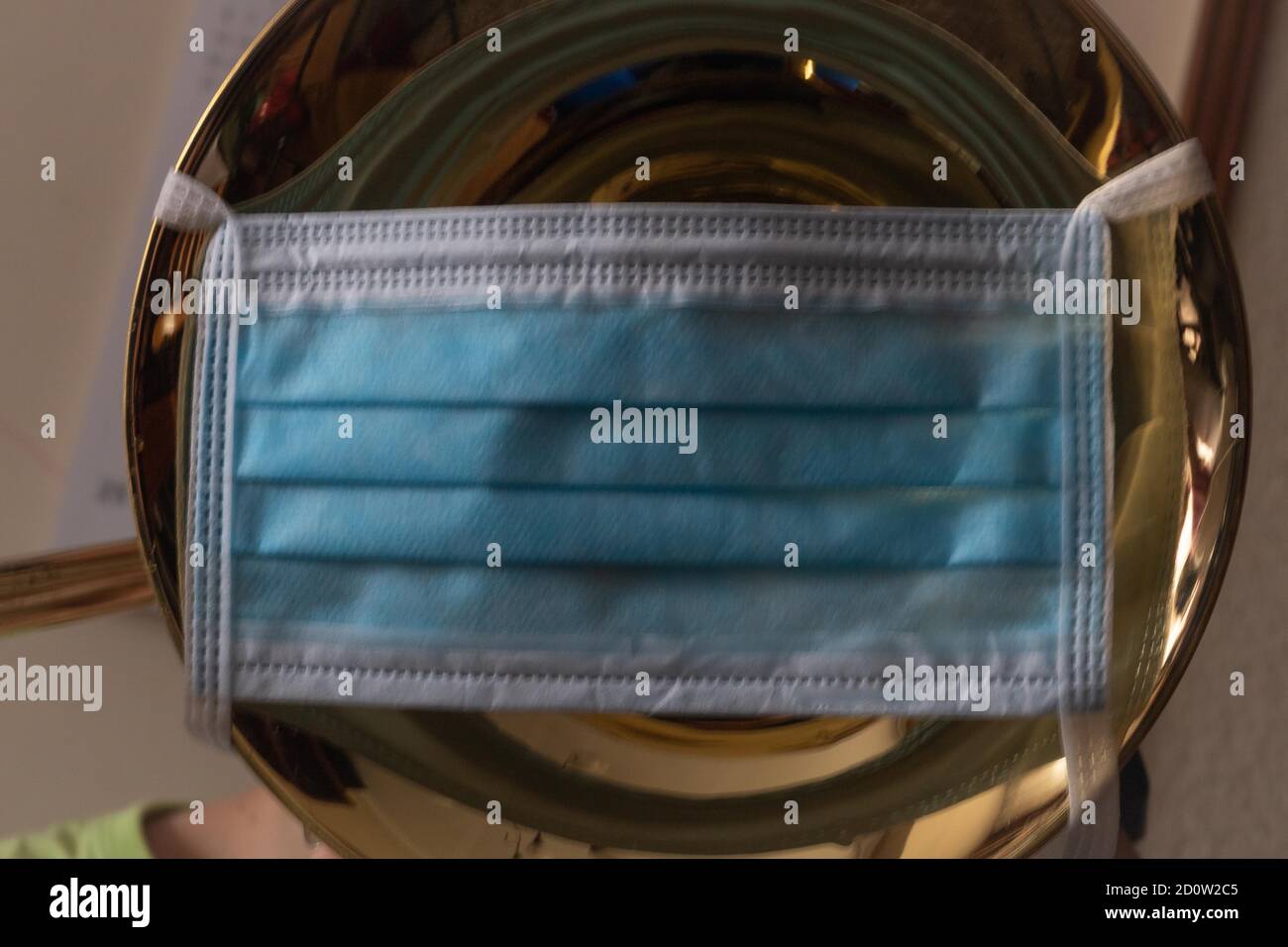 mask to protect the covid-19 put on the trombone instrument in the ...