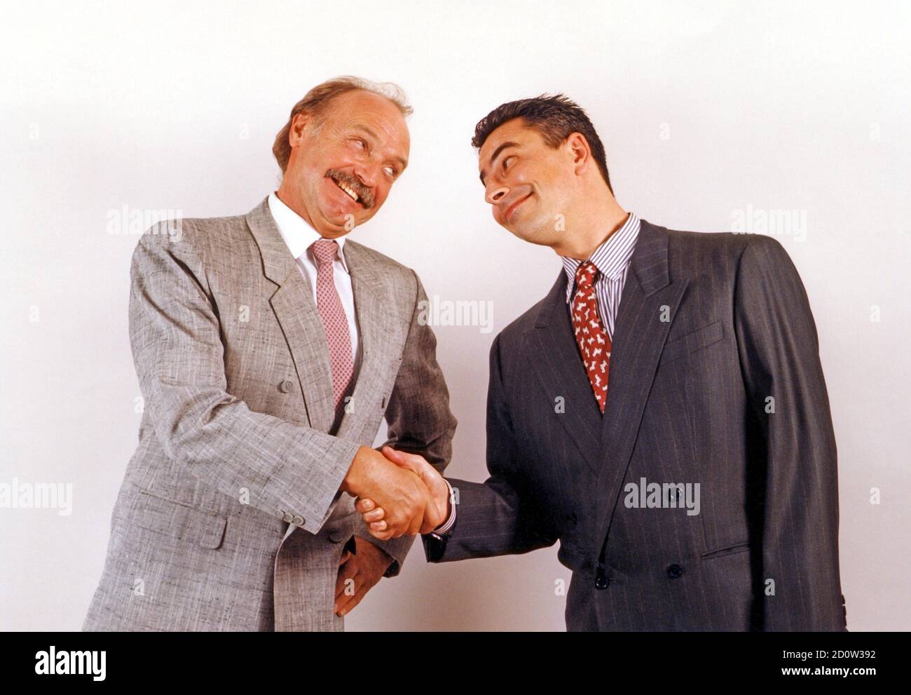 Businessmen shake hands, funny, Berlin, Germany, Europe Stock Photo - Alamy