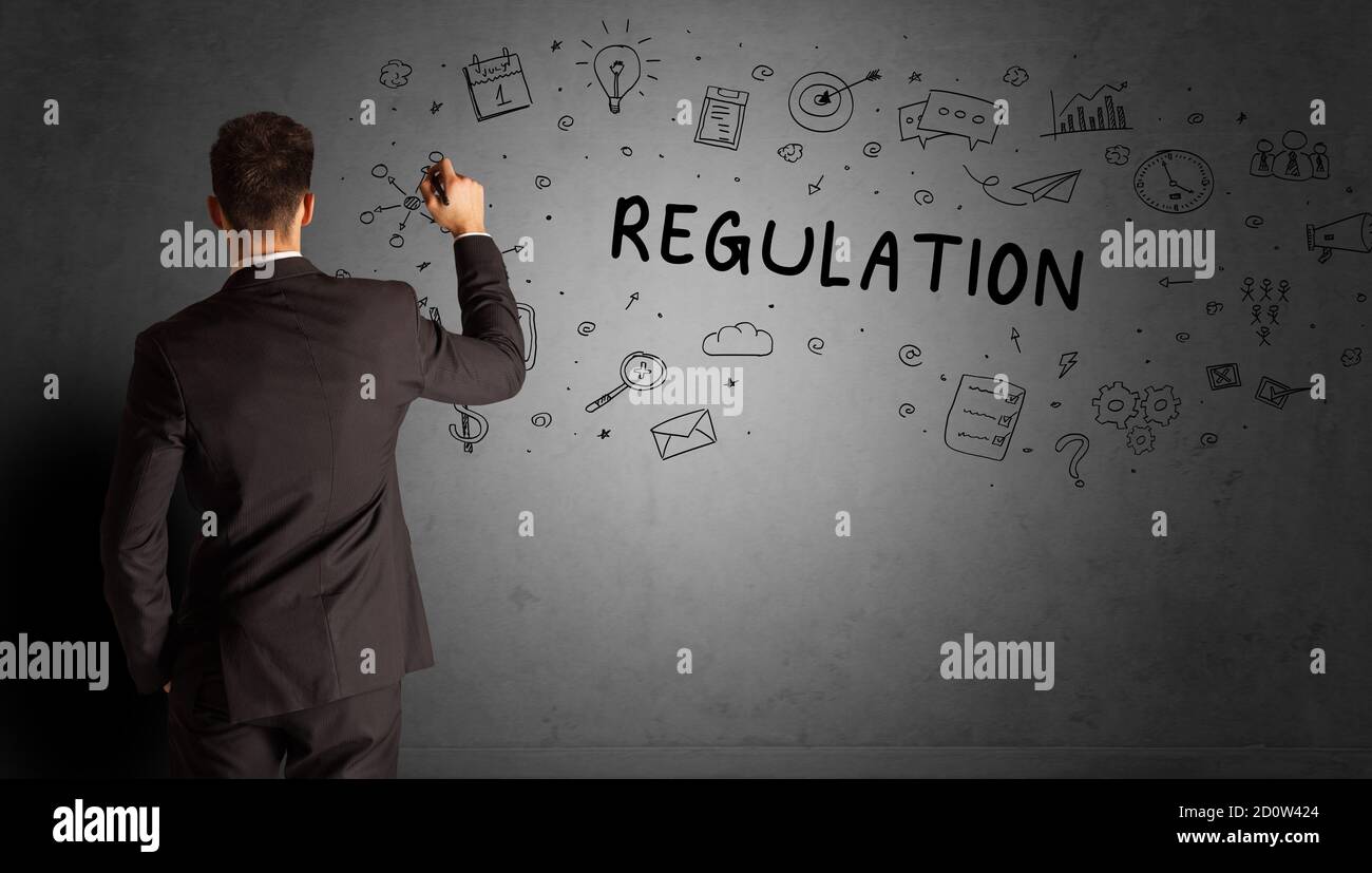 businessman drawing a creative idea sketch with REGULATION inscription ...