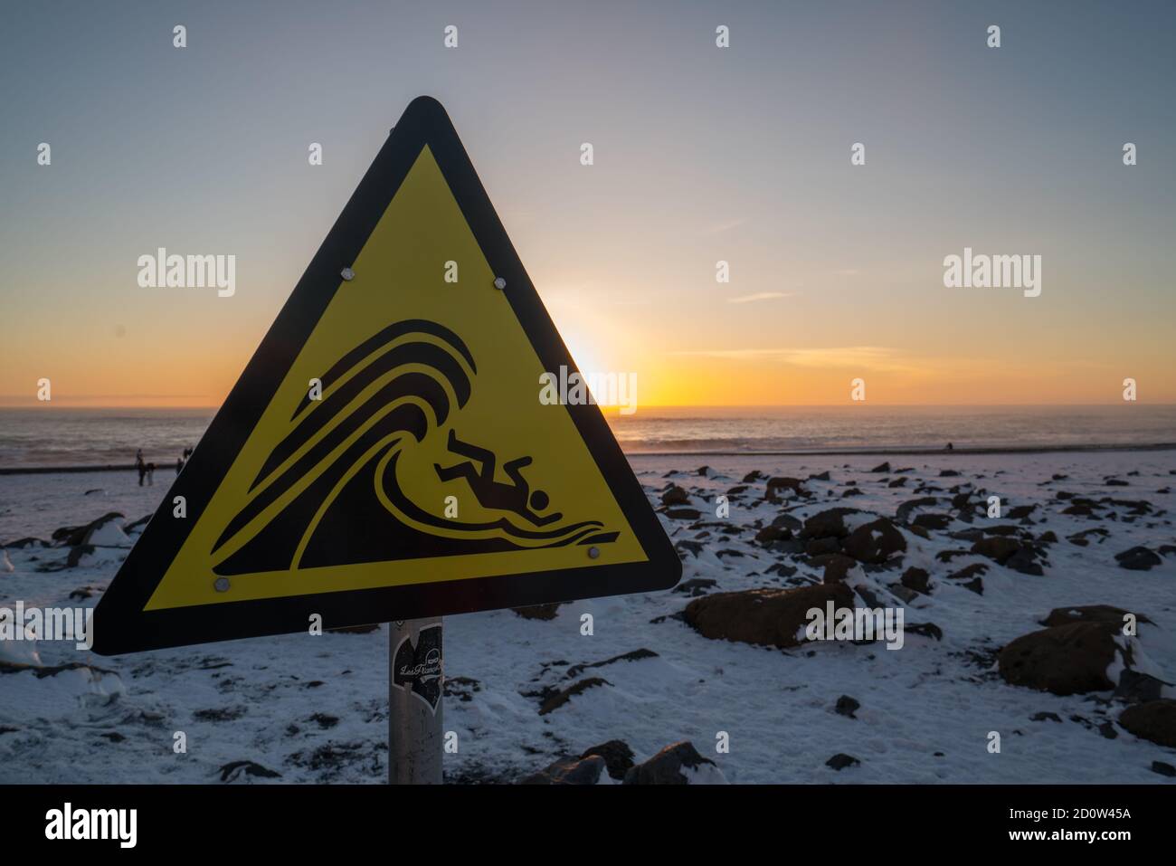 Dangerous Wave Sign on Black Sand Beach Stock Photo - Alamy