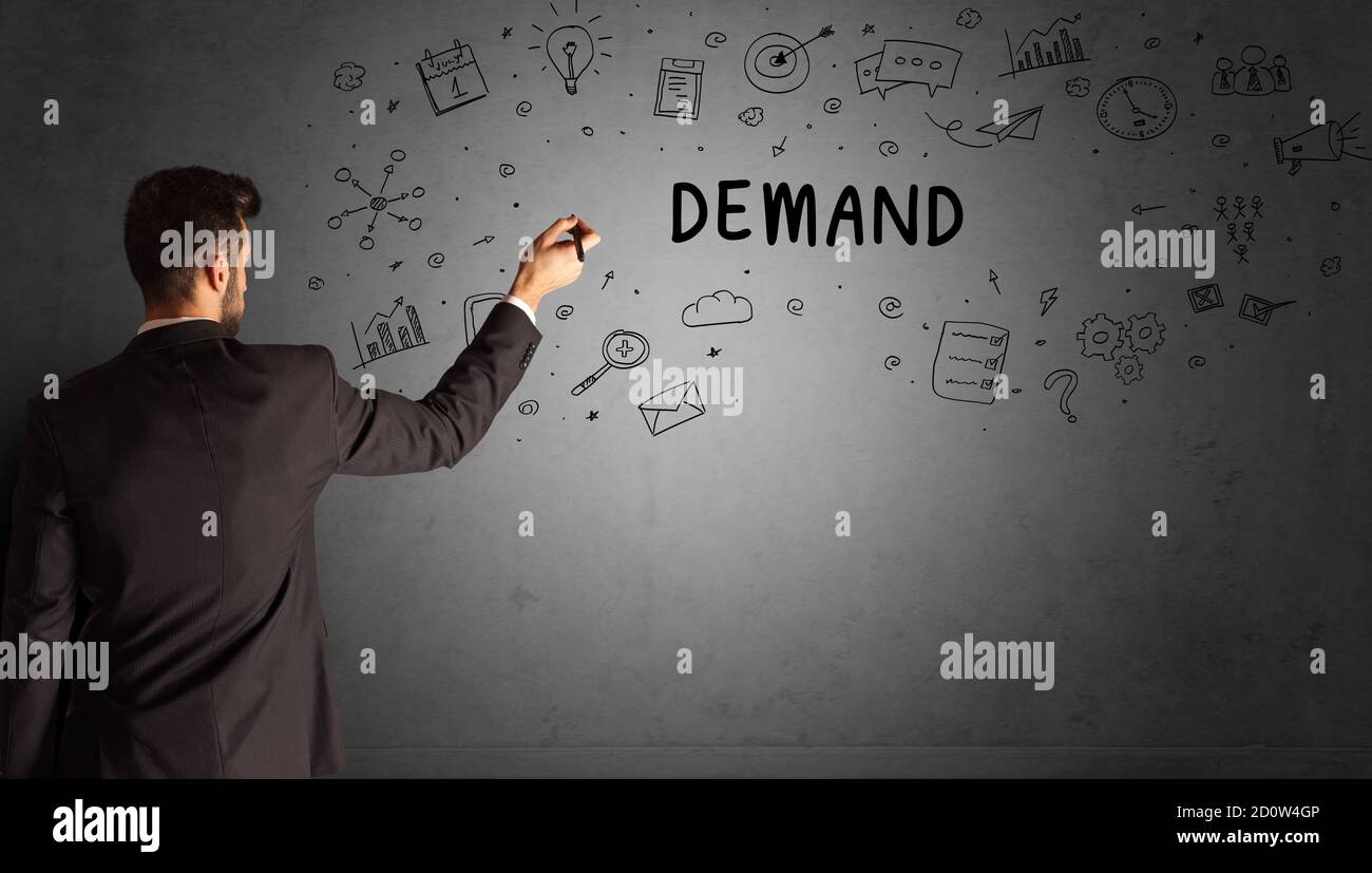 businessman drawing a creative idea sketch with DEMAND inscription ...