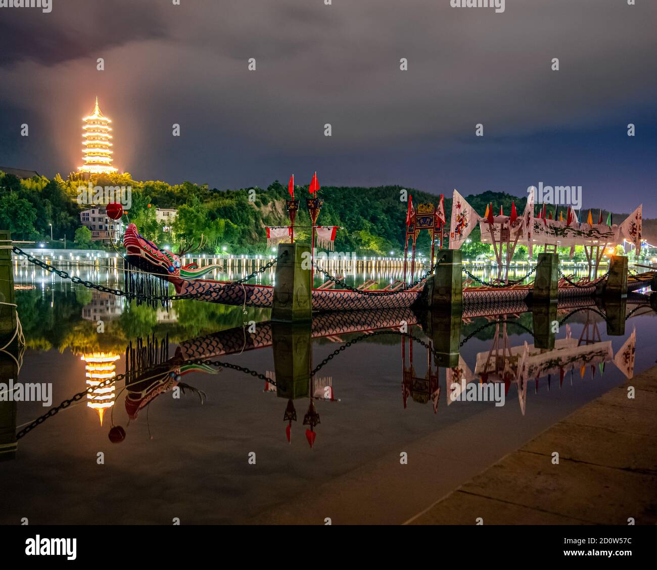 A dragon boat docked at night Stock Photo - Alamy