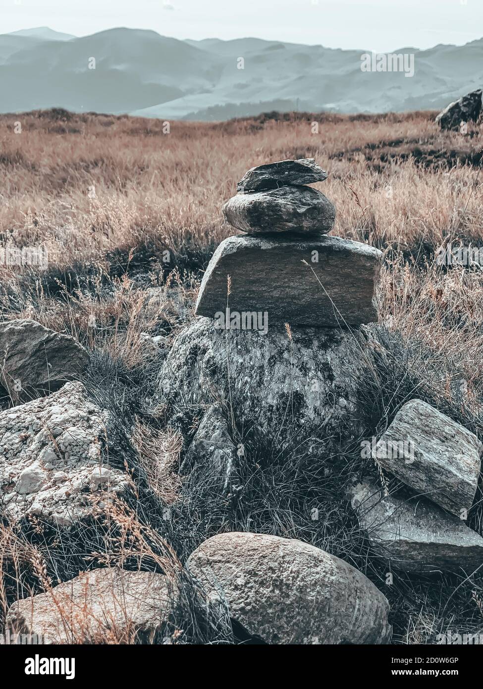 Closeup of stacked boulders in the open dry terrain Stock Photo - Alamy
