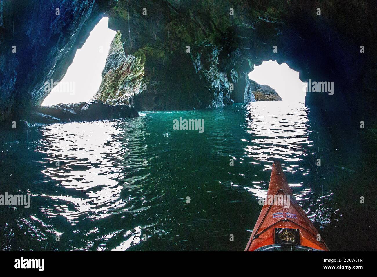 Sea kayaking in a sea cave on the north Pembrokeshire Coast Stock Photo ...