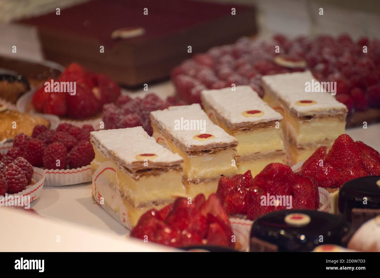 Assortment of french fresh baked sweet pastry with fresh fruits and ...