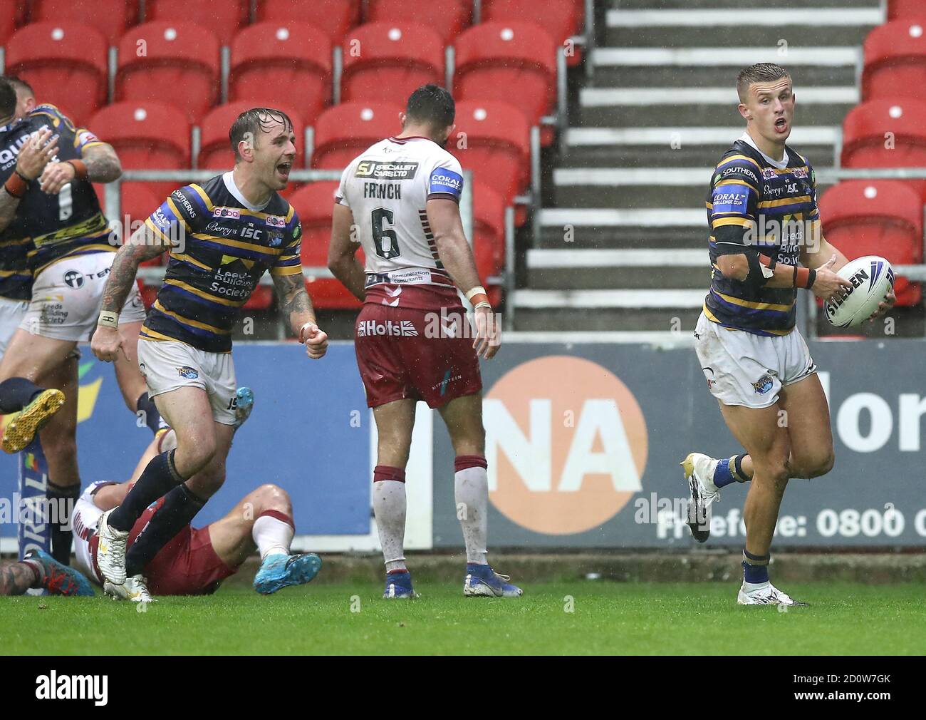 Leeds Rhinos' Ash Handley (right) celebrates scoring his side's fourth ...