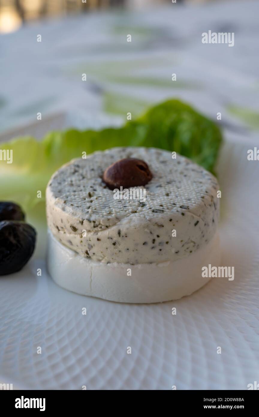 Cheese collection, French soft white goat cheese with aromatic herbs of ...