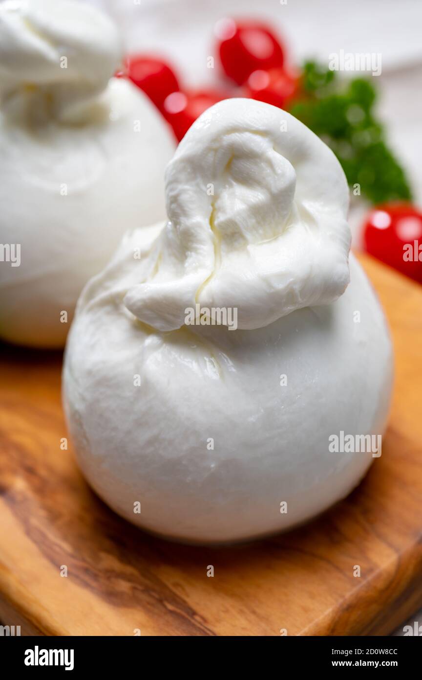 Cheese collection, fresh soft white burrata cheese ball made from ...