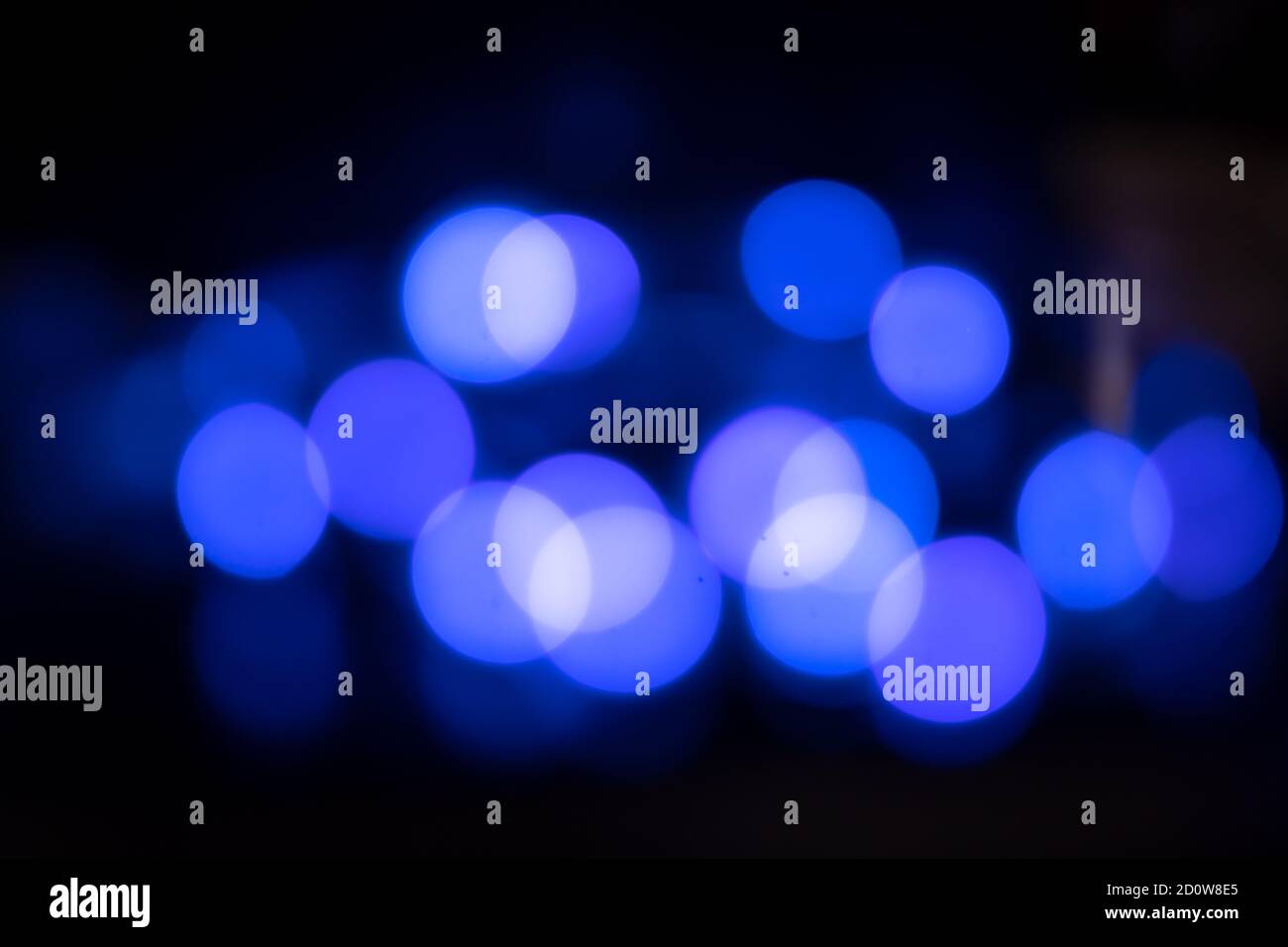 The colorful street lights that glow with blur at night look pretty ...