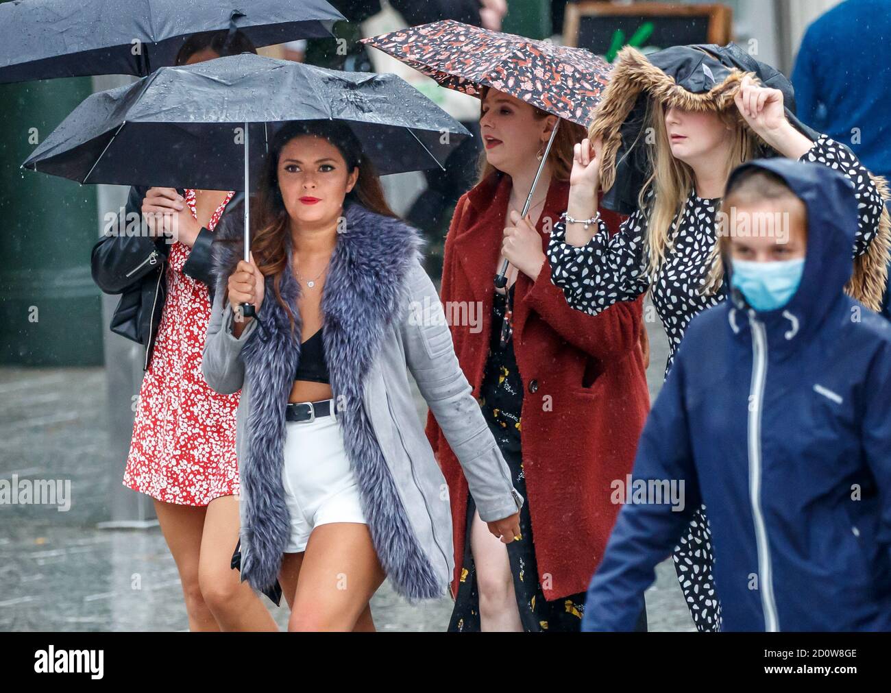 People with umbrellas in Nottingham city centre, as heavy rain is ...