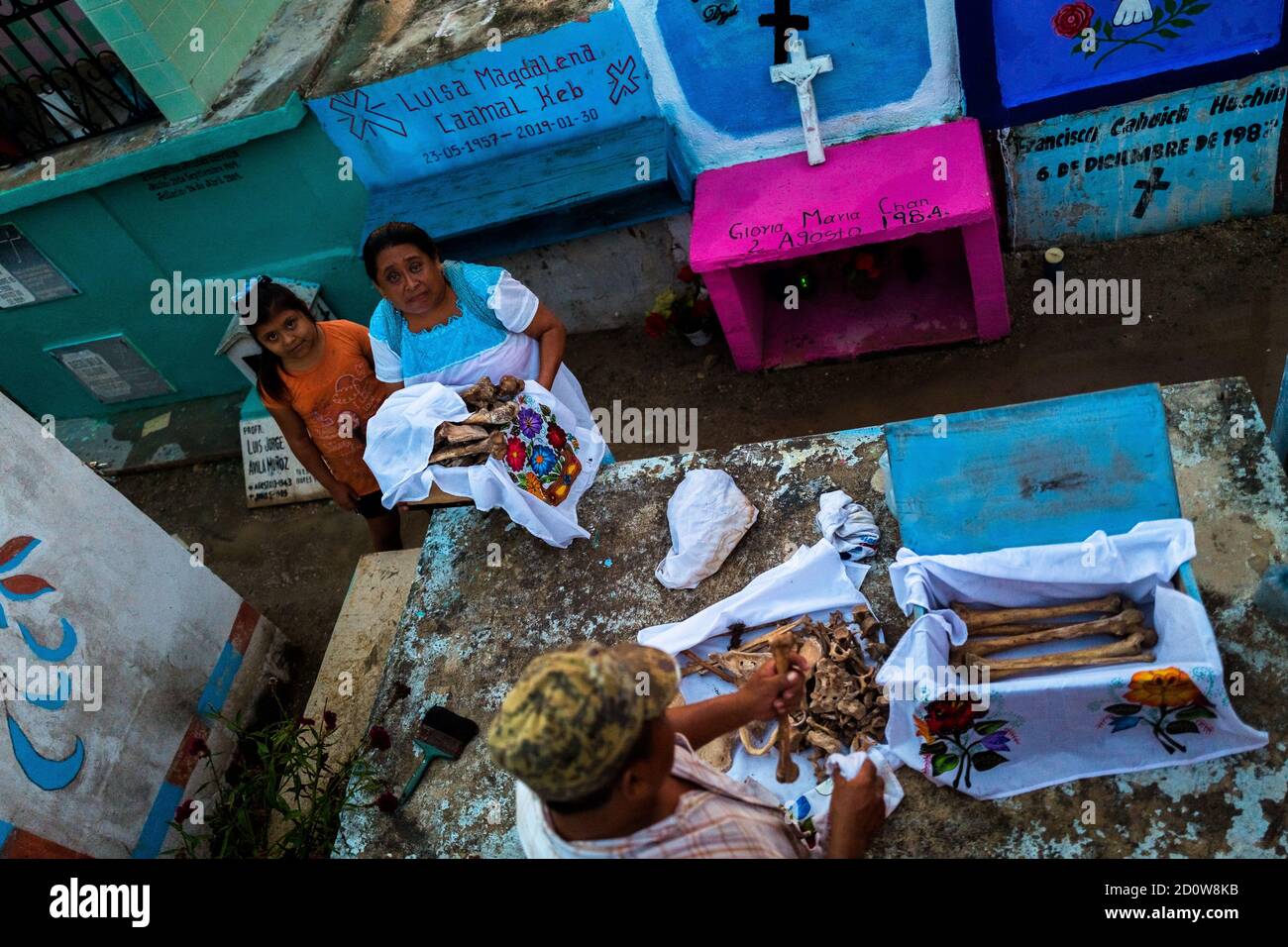 Mayan peasants take care of dried-up bones of a deceased family member ...