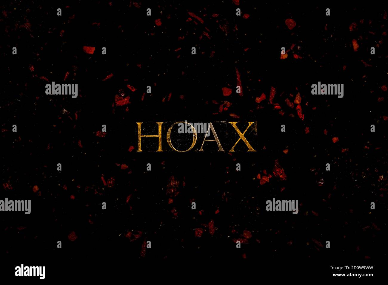 Hoax text in neon letters on black background with red virus particles ...