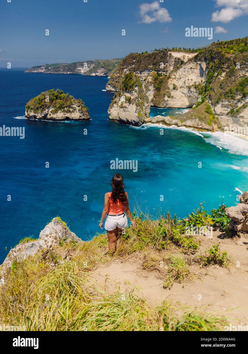 Traveller woman posing near Atuh beach and looks to ocean on Nusa ...