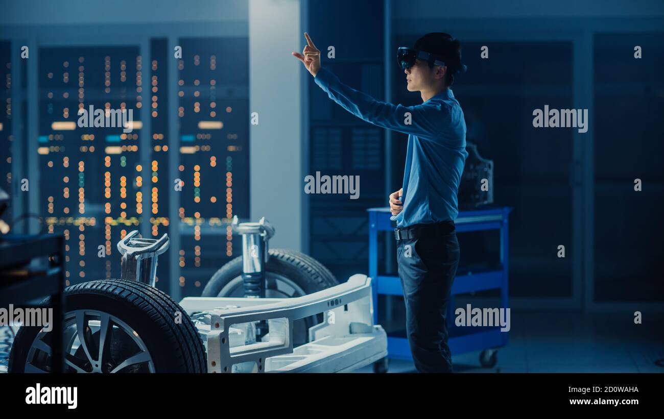 Automotive Engineer Working on Electric Car Chassis Platform, Using ...