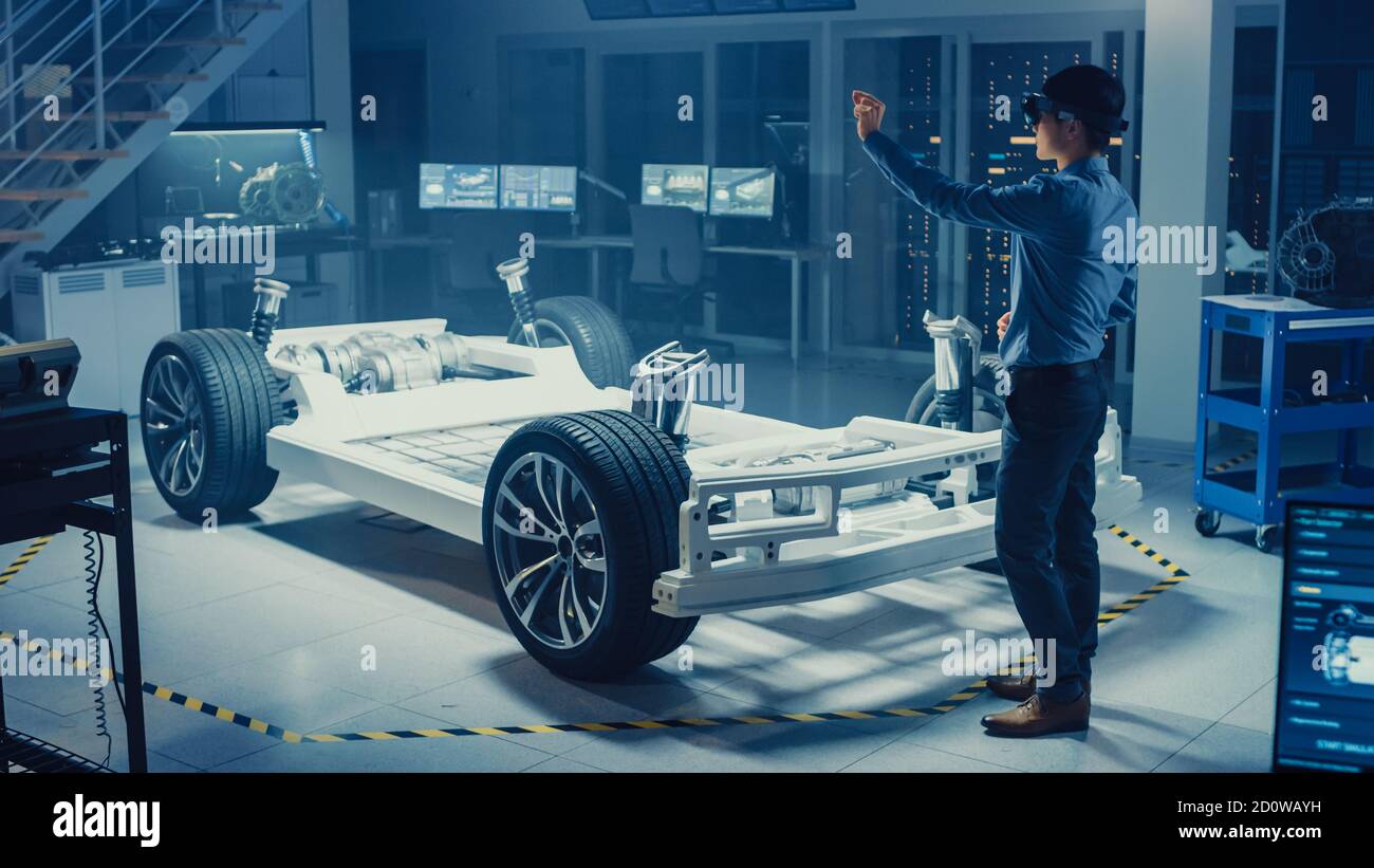 Automotive Engineer Working on Electric Car Chassis Platform, Using ...