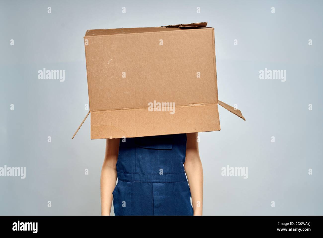 Woman in working uniform box packing service lifestyle Stock Photo - Alamy