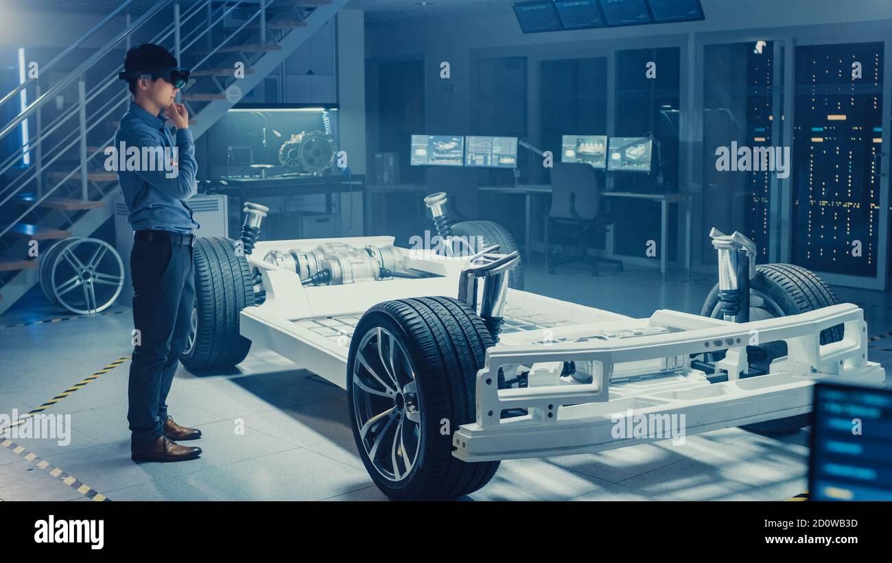 Automotive Engineer Working on Electric Car Chassis Platform, Using ...