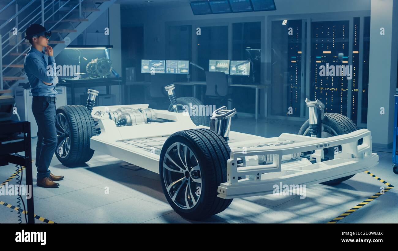 Automotive Engineer Working on Electric Car Chassis Platform, Using ...