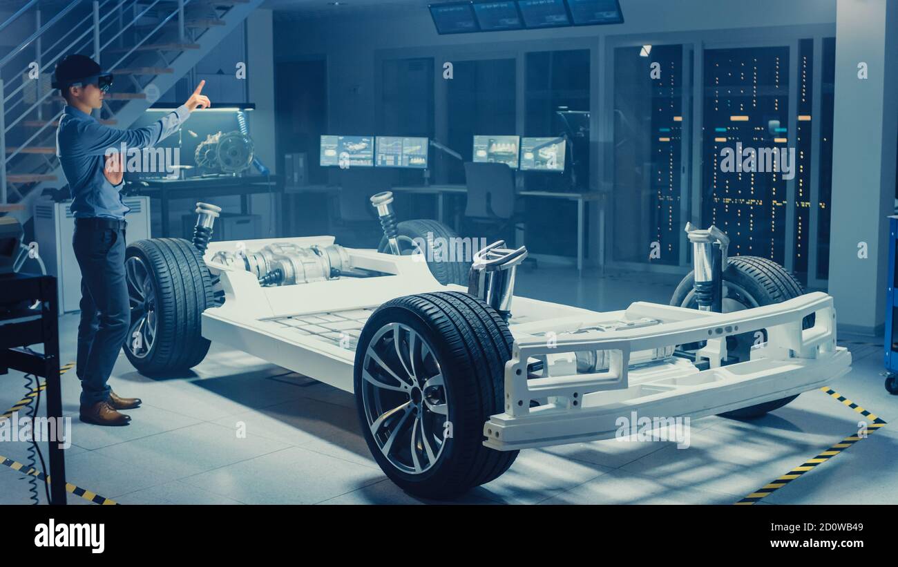 Automotive Engineer Working on Electric Car Chassis Platform, Using ...