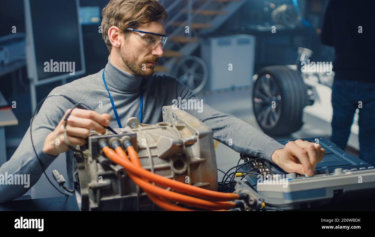 Professional Automotive Engineer in Glasses with a Computer and ...