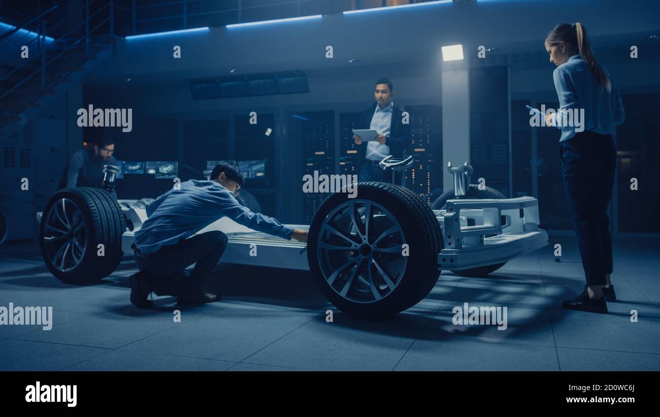 Team of Automotive Engineers Working on Electric Car Platform Chassis ...