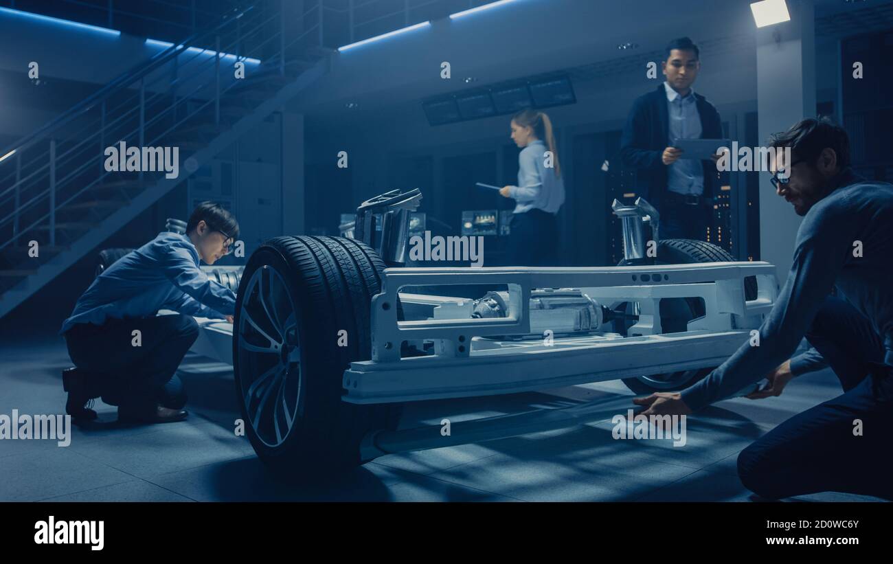 Team of Automotive Engineers Working on Electric Car Platform Chassis ...