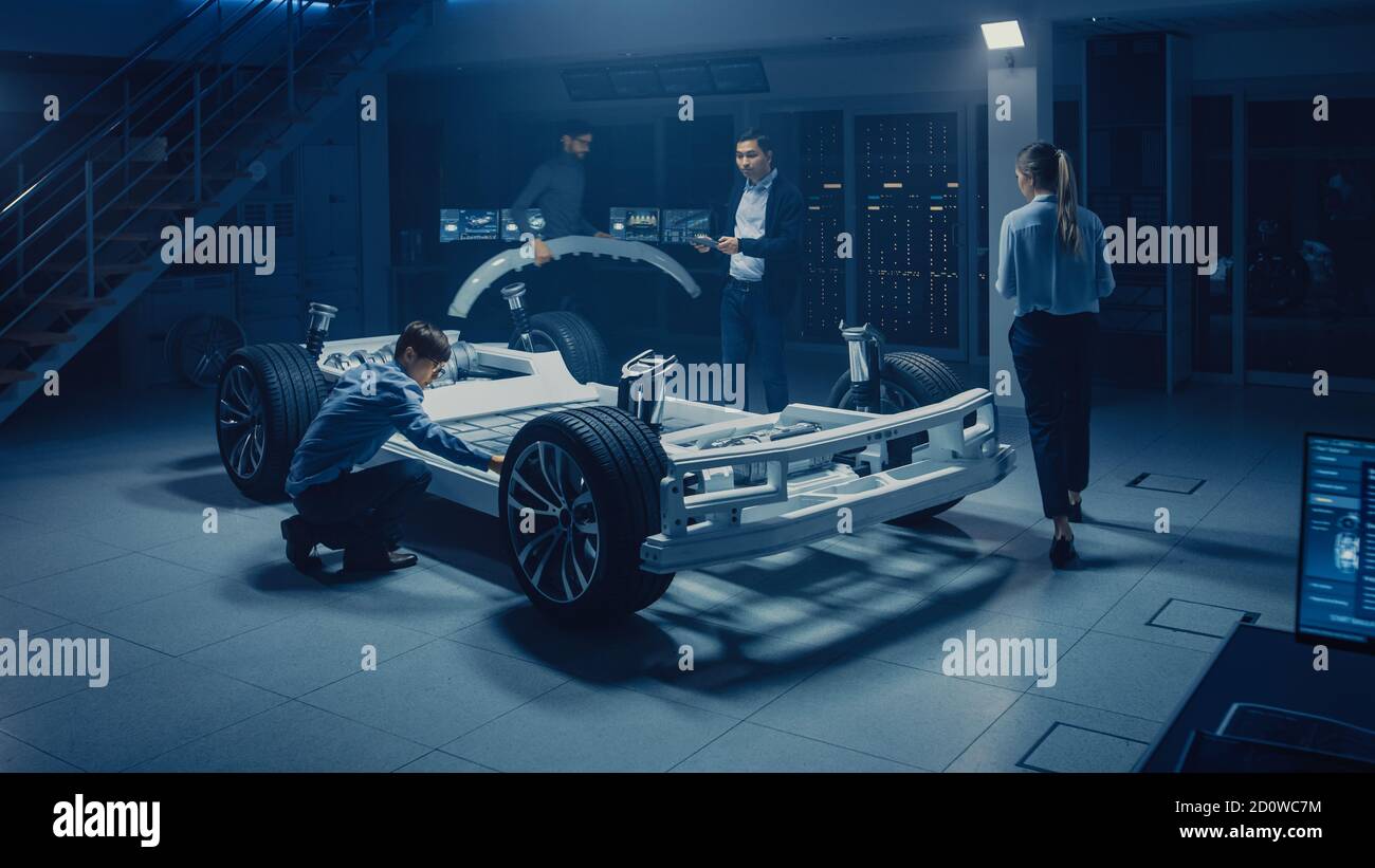 Team of Automotive Engineers Working on Electric Car Platform Chassis ...