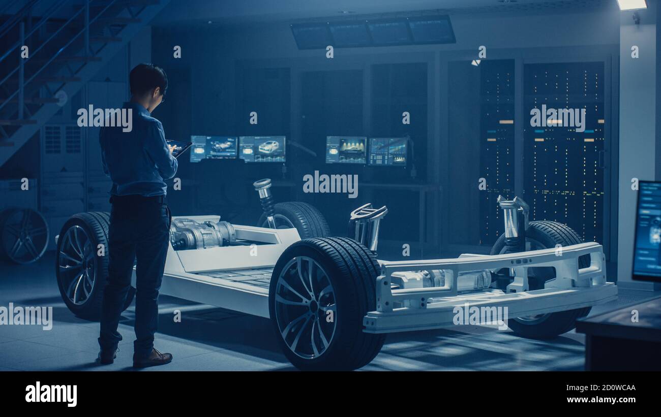 Automobile Engineer Working on Electric Car Chassis Platform, Using ...