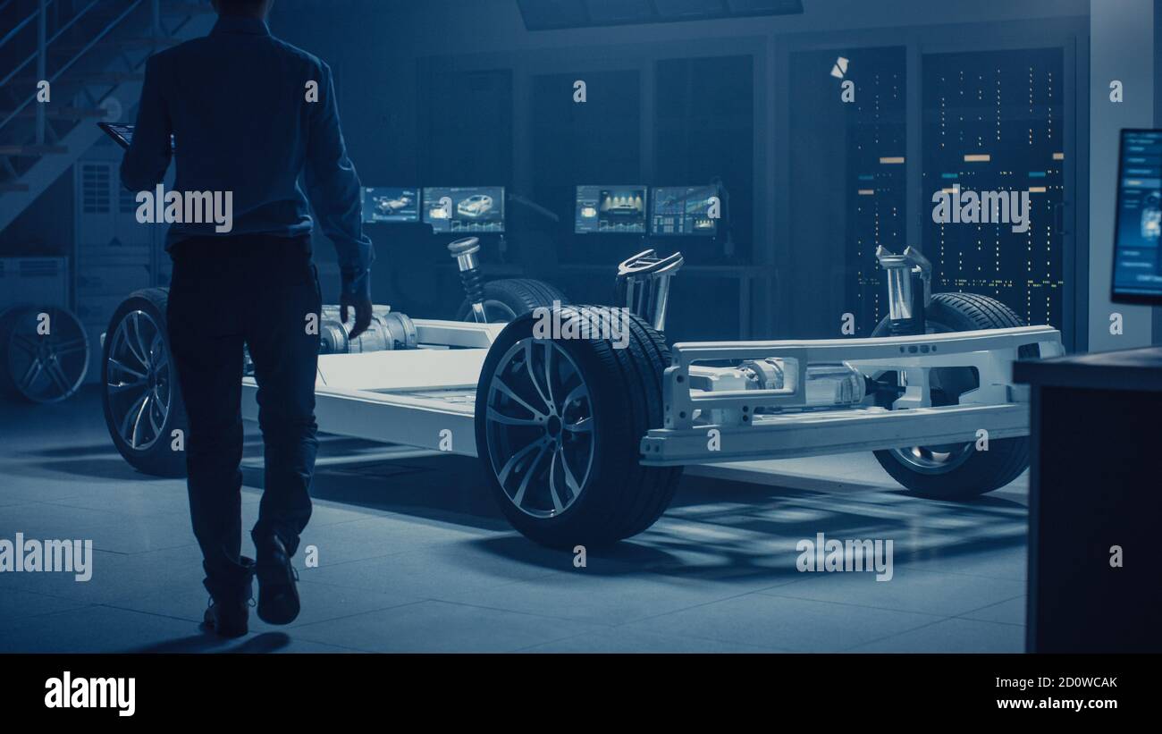 Automobile Engineer Enter Automotive Innovation Facility to Work on ...