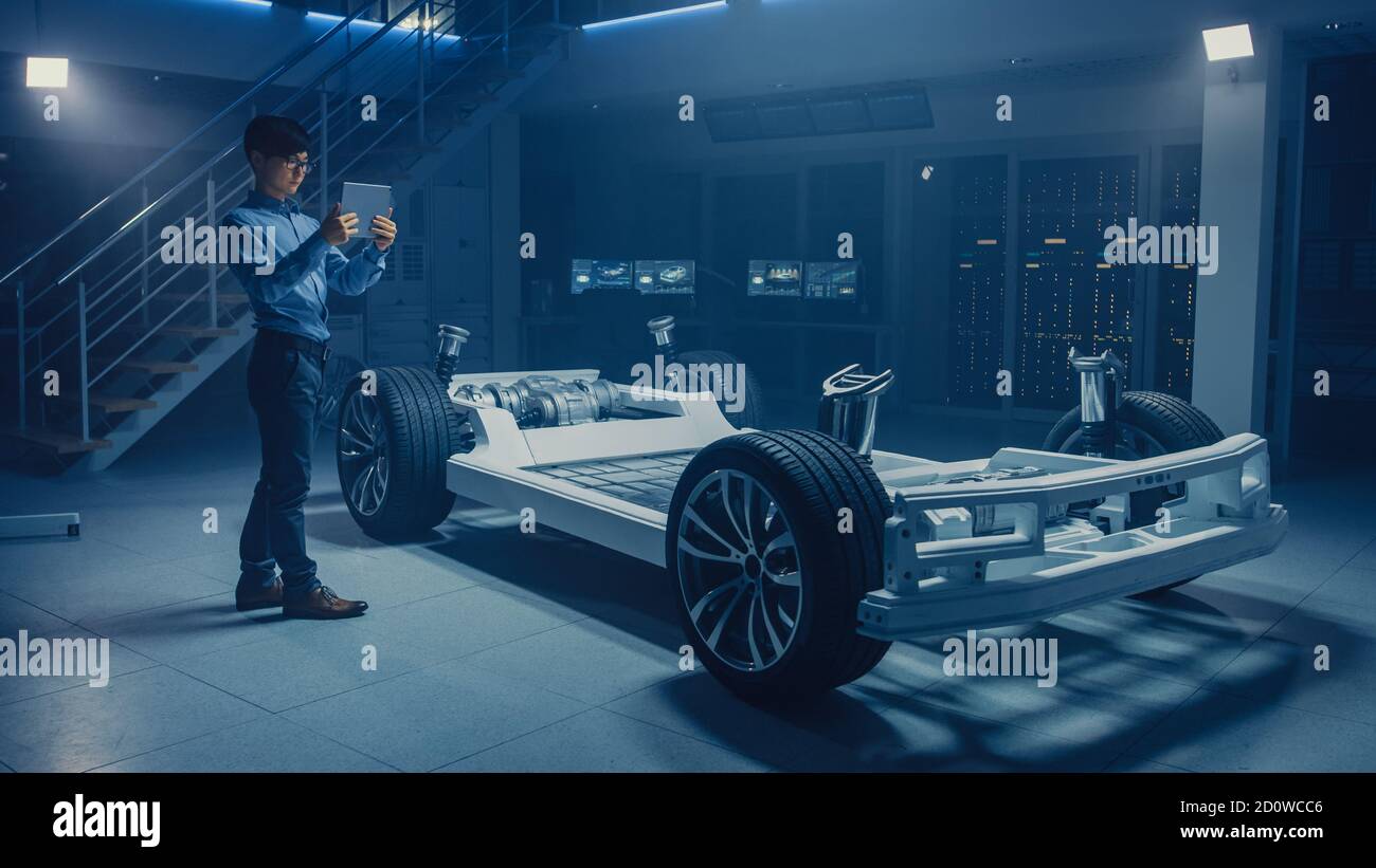 Automobile Engineer Working on Electric Car Chassis Platform, Using ...