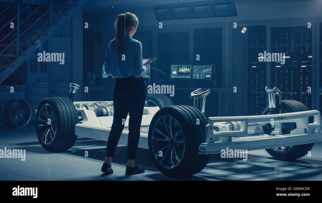 Automobile Female Engineer Working on Electric Car Chassis Prototype ...