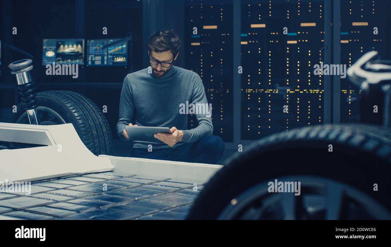 Automobile Design Engineer Sitting Beside Hybrid Electric Car Chassis ...