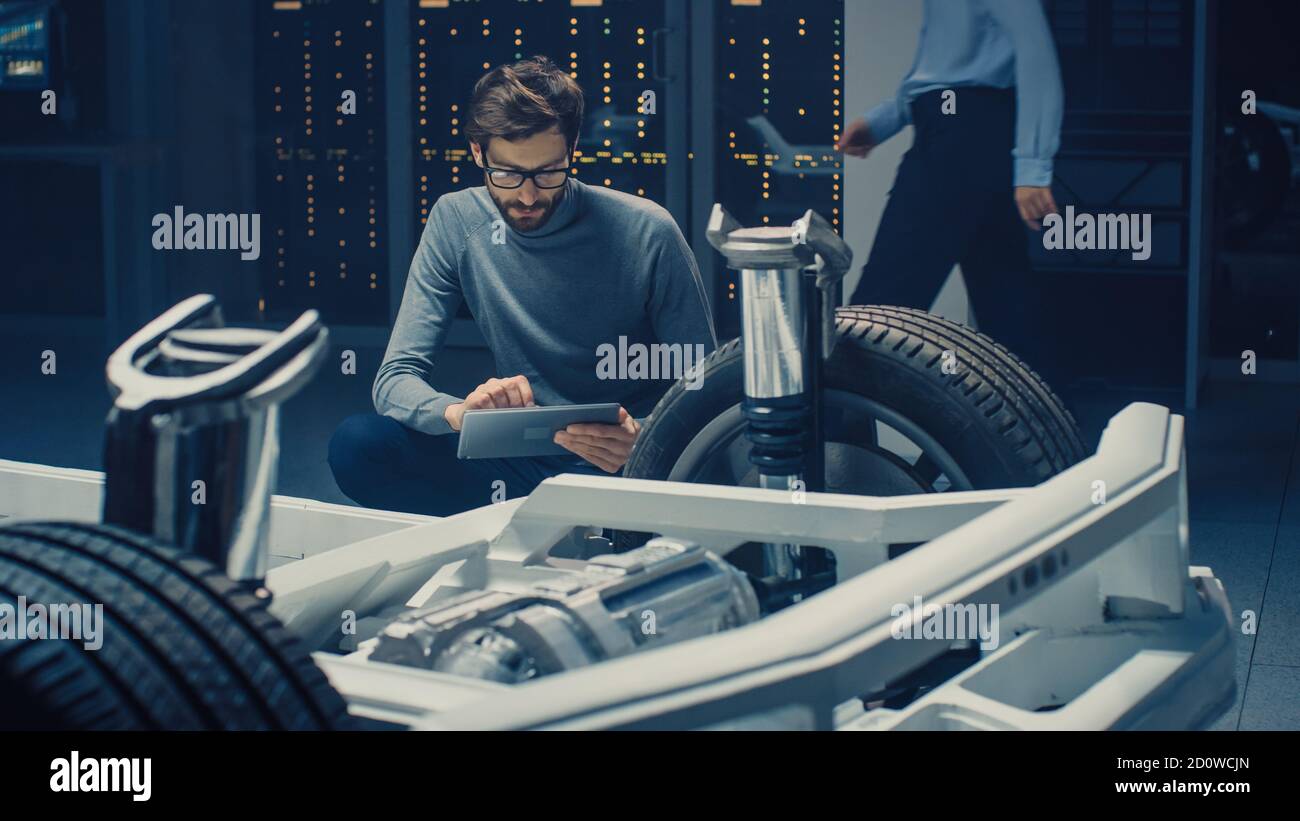 Automobile Design Engineer Sitting Beside Hybrid Electric Car Chassis ...