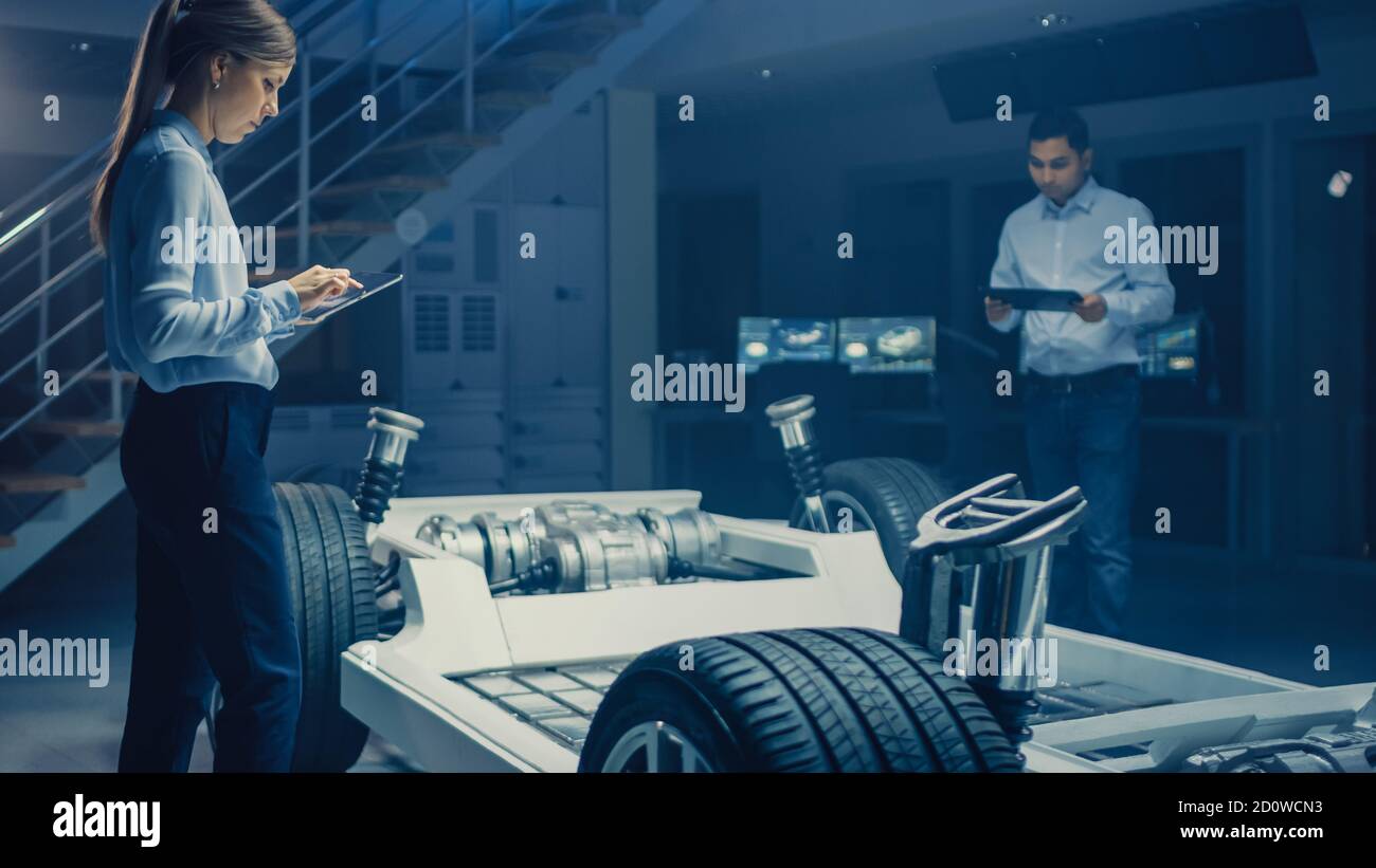 Team of Automotive Engineers Working on Electric Car Chassis Platform ...