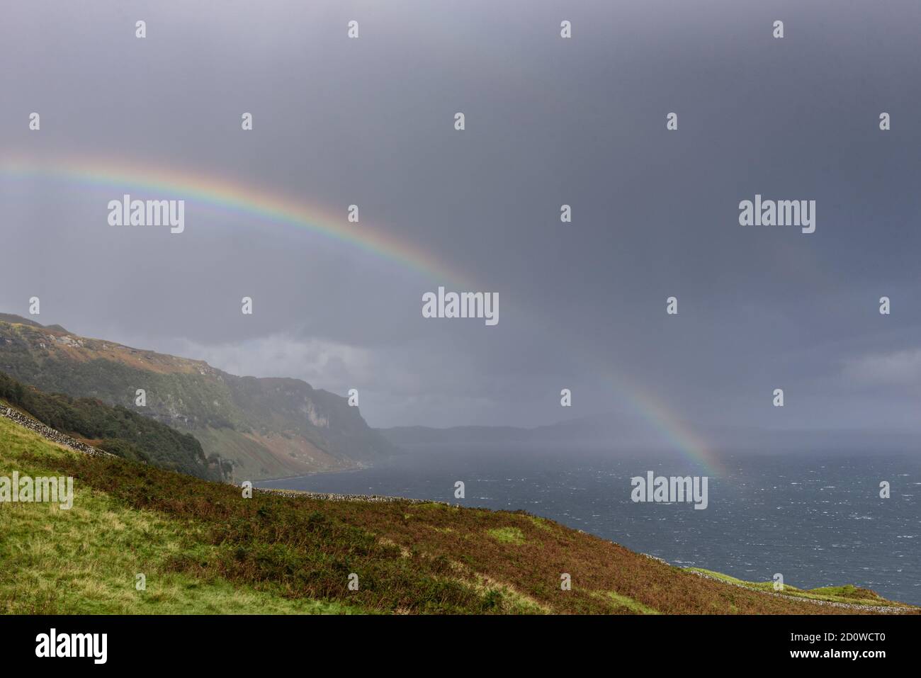 Rain squall and Rainbow on the east coast of Raasay ion Scotland Stock ...