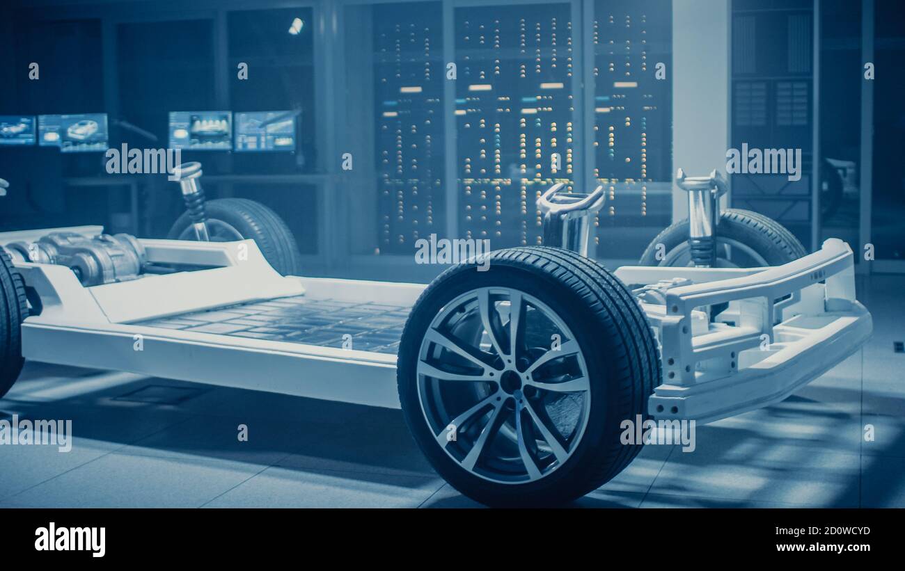 Automobile Engineers Discussing and Designing Electric Car Chassis ...