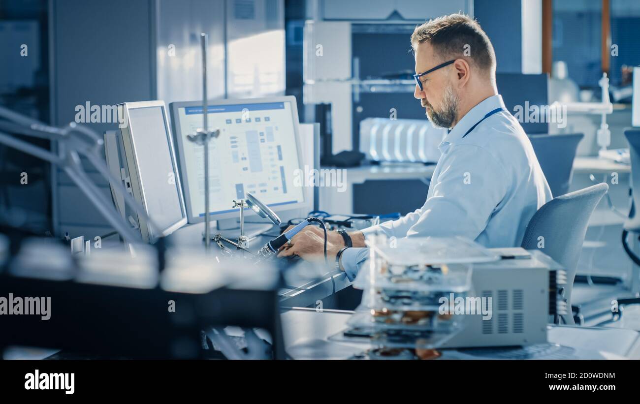 Electronics Development Engineer Working on Computer, Designing ...