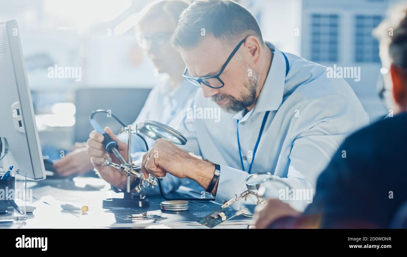 Team of Electronics Development Engineers Working on Computers ...