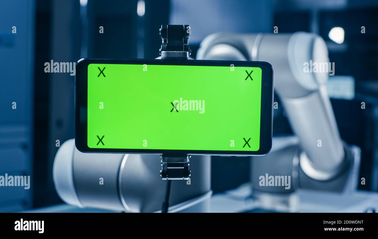 Robot Arm Holding Green Mock-up Screen Smartphone in Landscape Mode ...