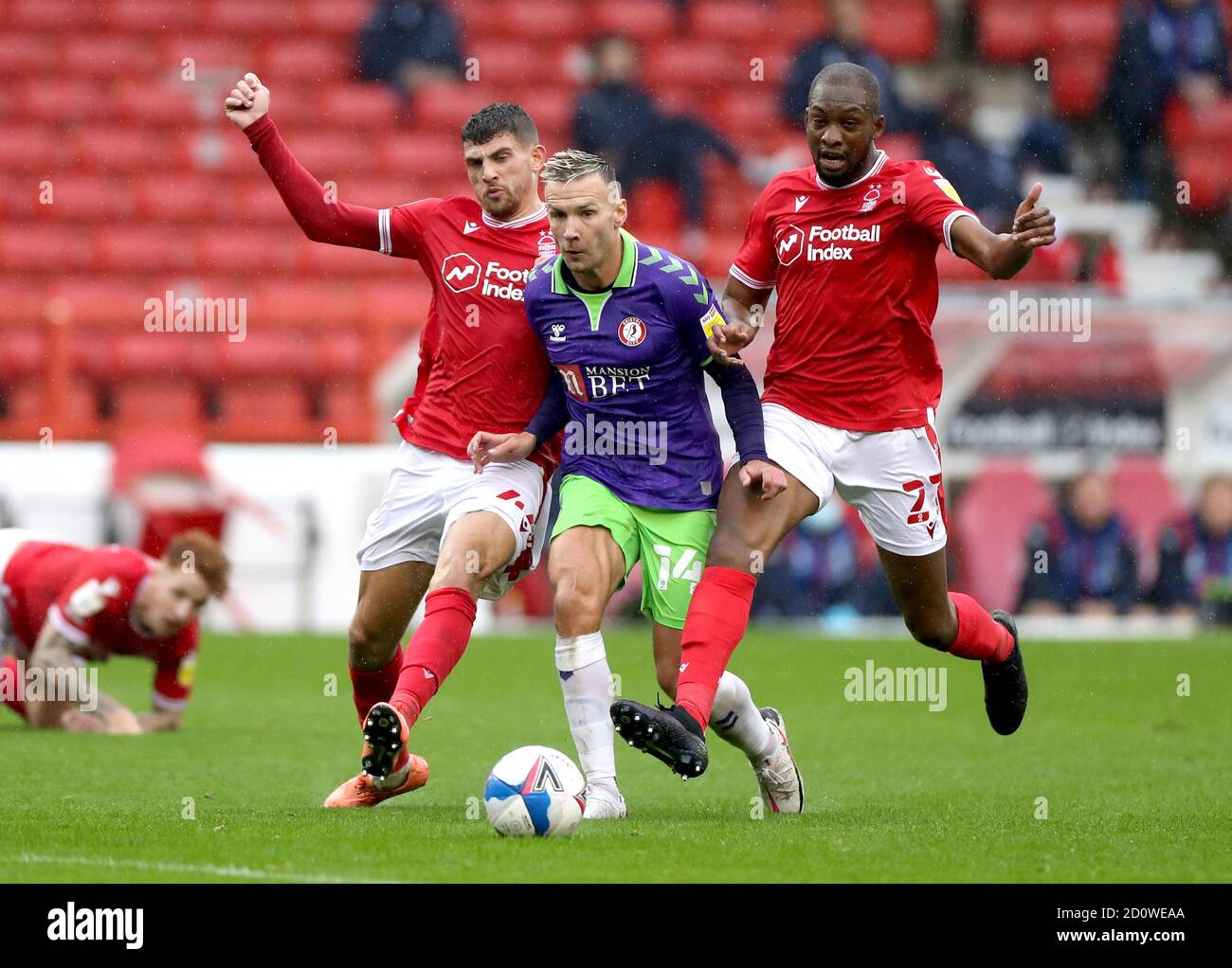 Bristol City's Andreas Weimann (centre) battles for the ball with ...