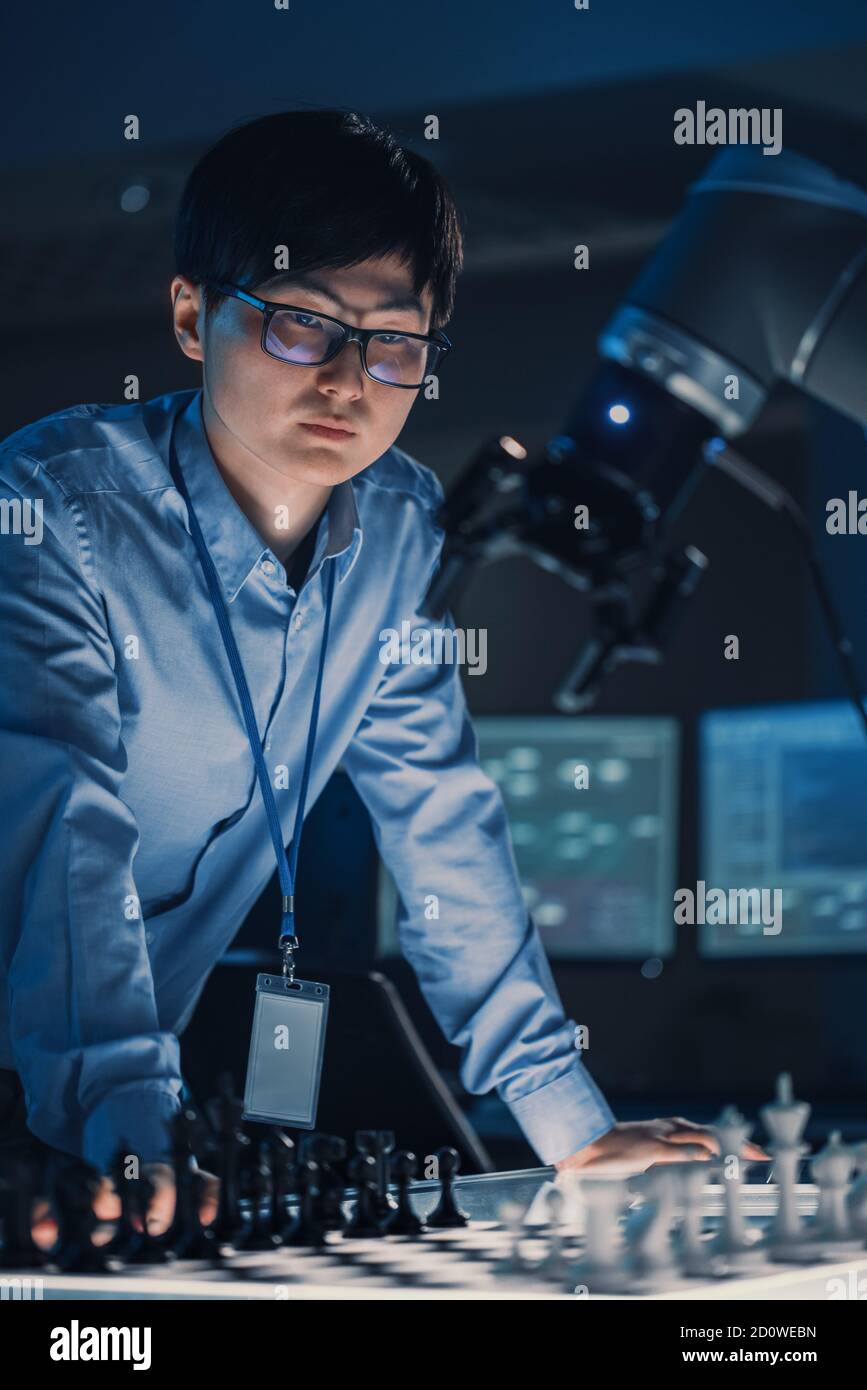 Vertical Shot of a Professional Japanese Development Engineer Testing ...
