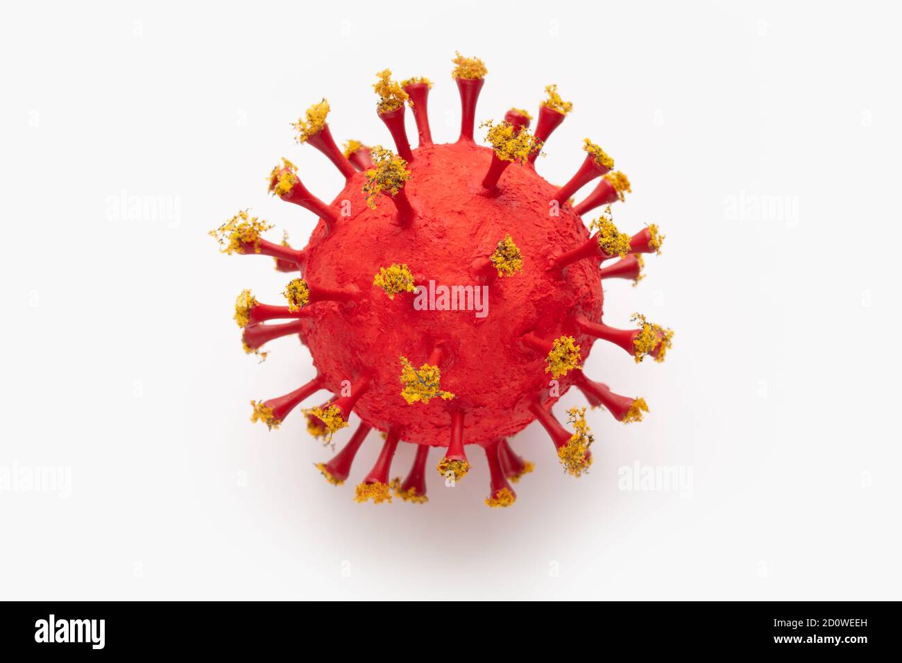 A photograph of a large red virus sculpture. The artwork inspired by ...