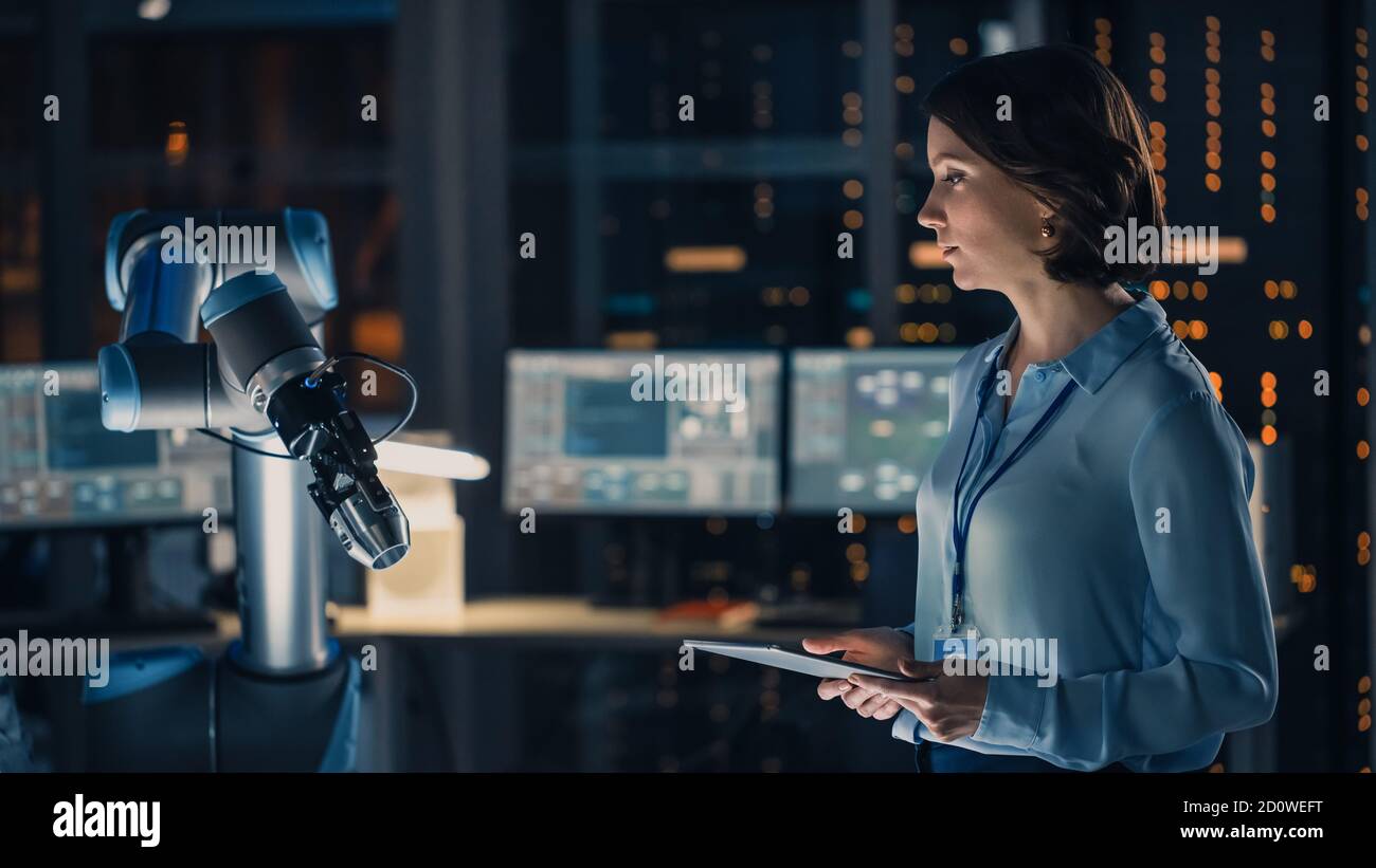 Female Engineer With Tablet Computer Analyse How A Futuristic Robotic