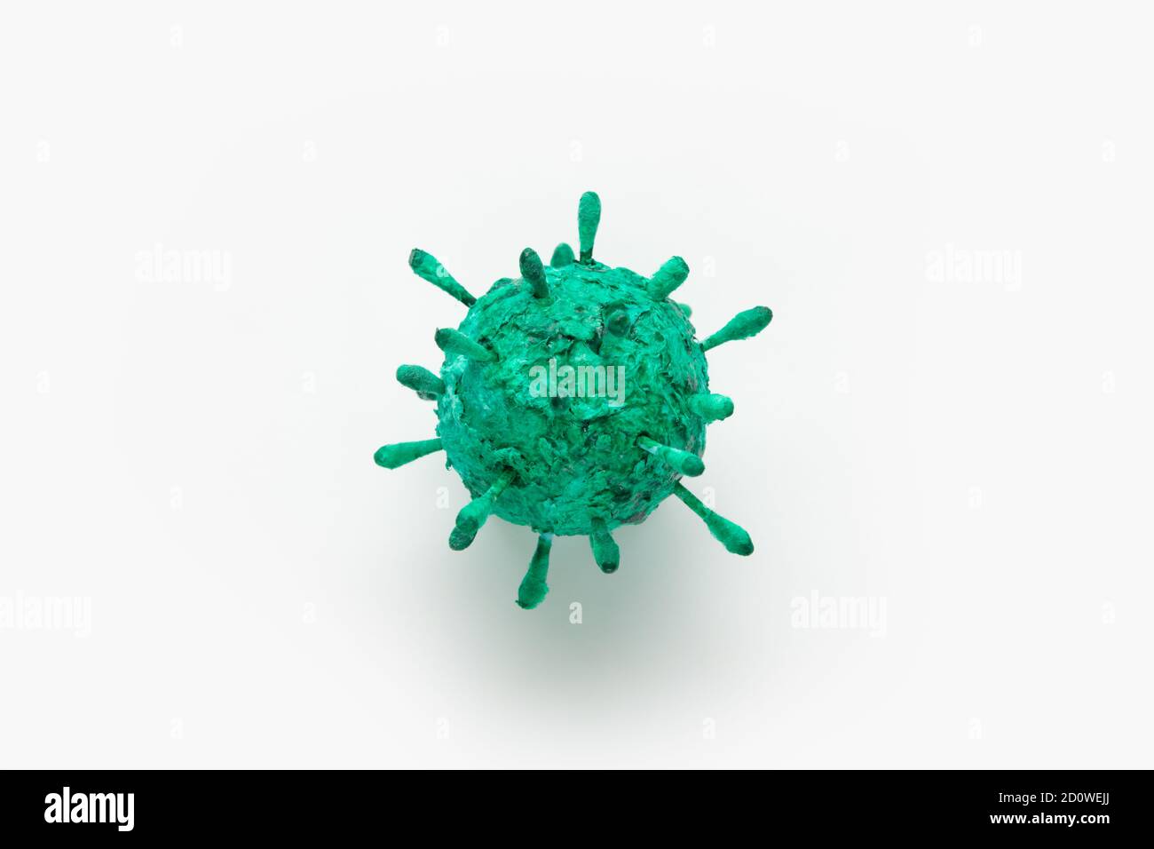 A photograph of a green virus sculpture. The artwork inspired by the ...
