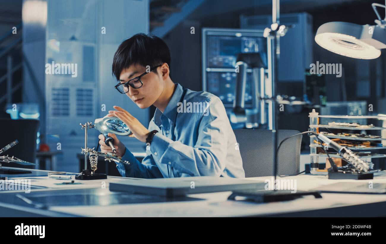 Professional Japanese Electronics Development Engineer in Blue Shirt is ...