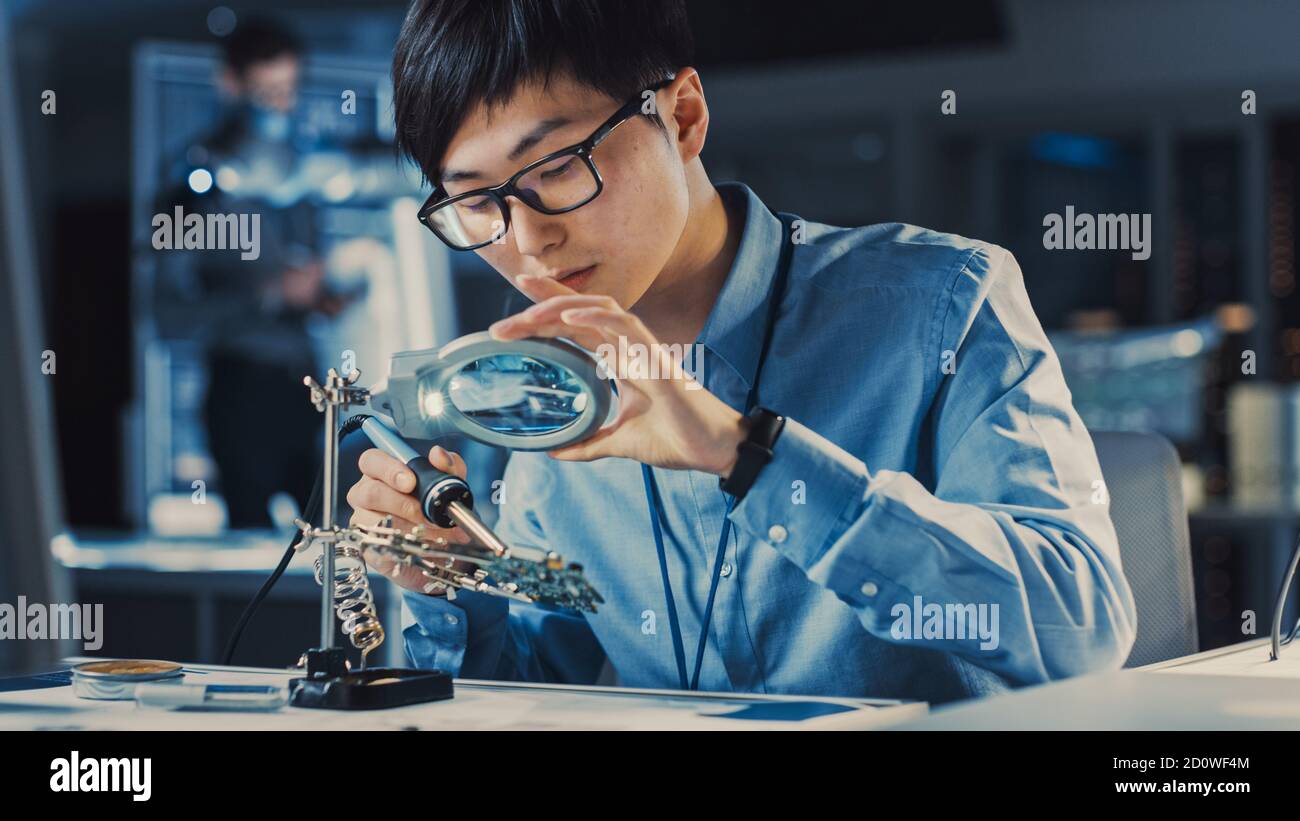 Professional Japanese Electronics Development Engineer in Blue Shirt is ...