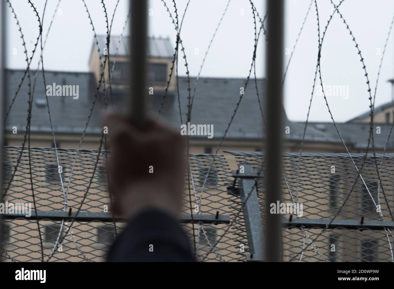 prisoner looking out of the window of a prison cell Stock Photo - Alamy